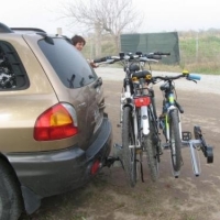 A load is overhanging from the back of a passenger car. Should it be ...